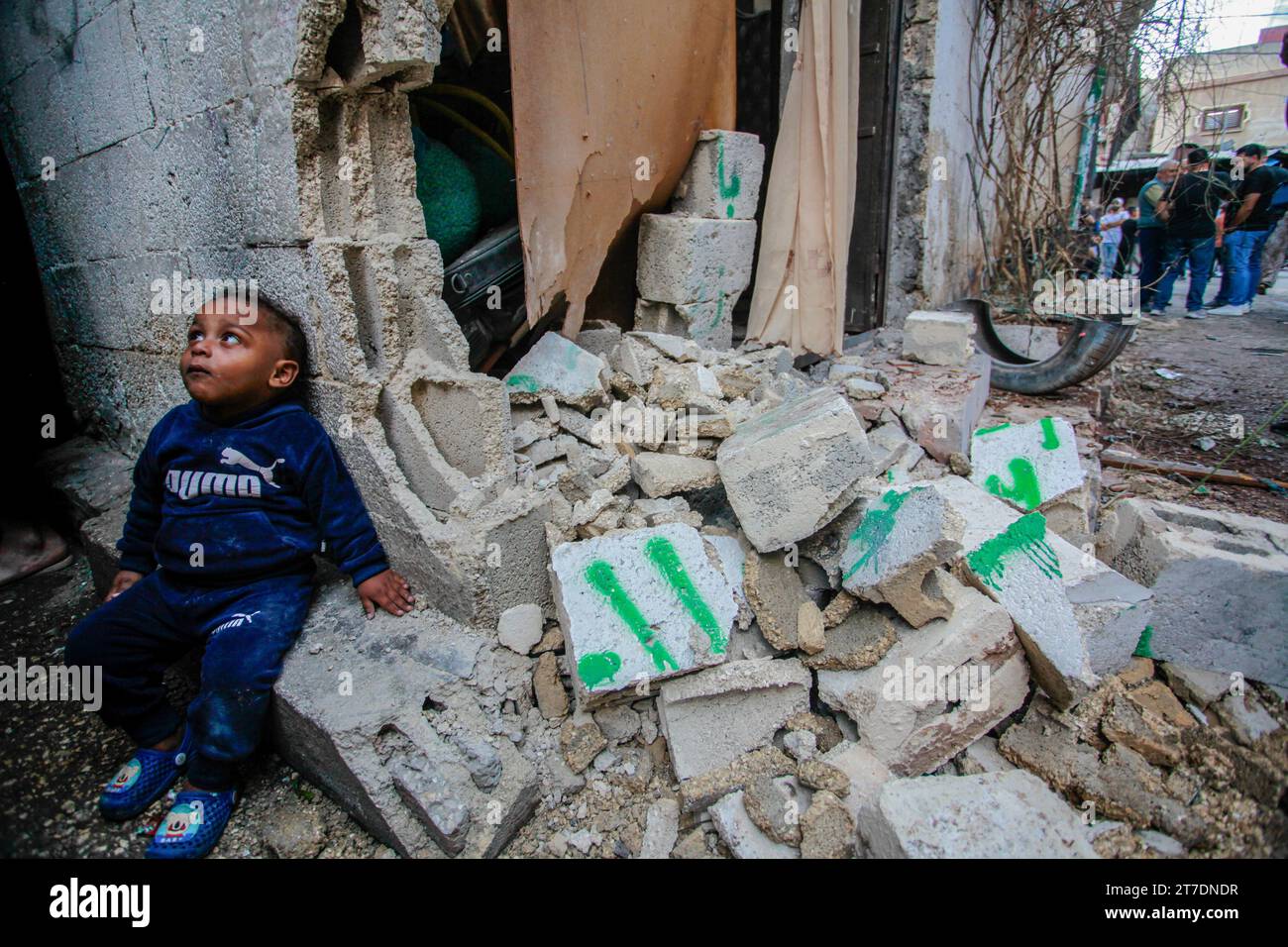 Tulkarm, Palestine. 14th Nov, 2023. A Palestinian child sits on the ...