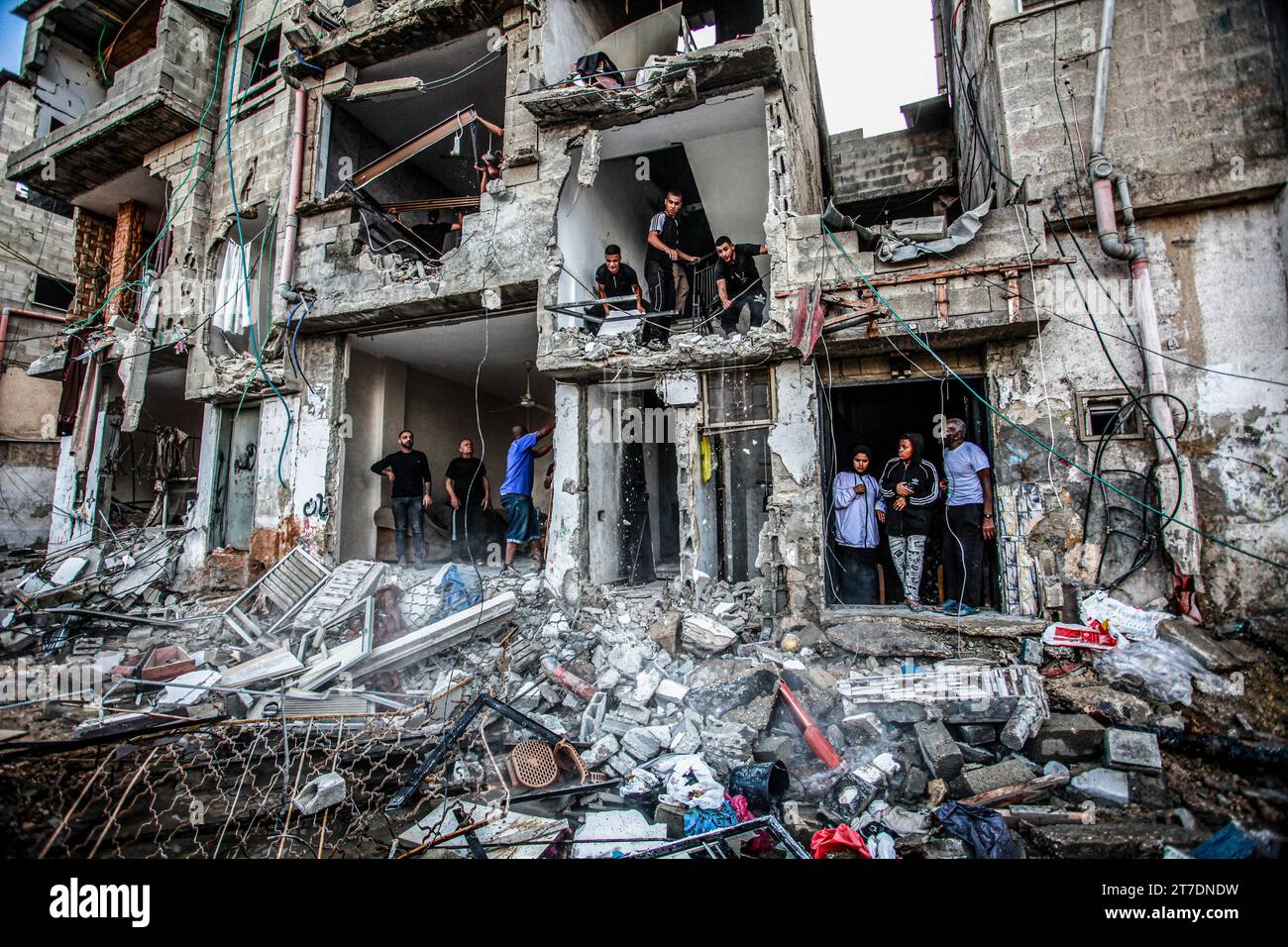 Tulkarm, Palestine. 14th Nov, 2023. Palestinians inspect a damaged ...