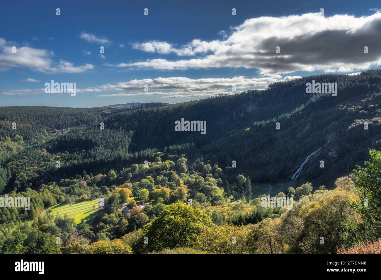 Tall Powerscourt Waterfall, valley, forests in autumn colours ...