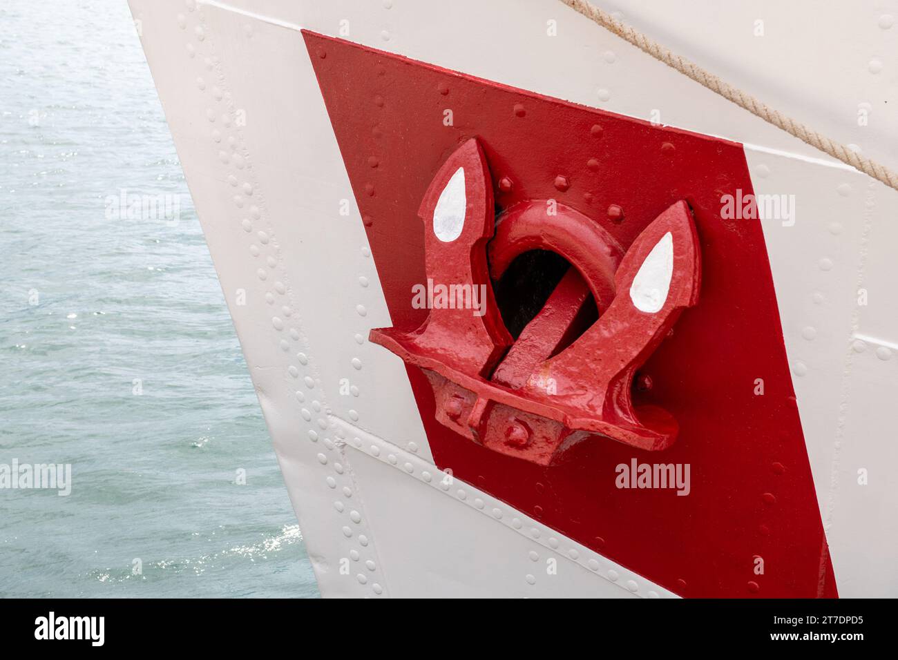 A red anchor on a white bow background Stock Photo - Alamy