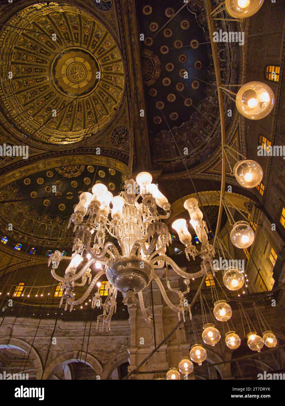 A luxurious and ornate church interior featuring a grand chandelier ...
