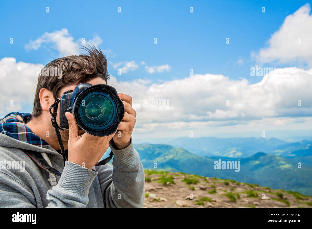 Men's hands held camera closeup. Man hand holding camera looking ...