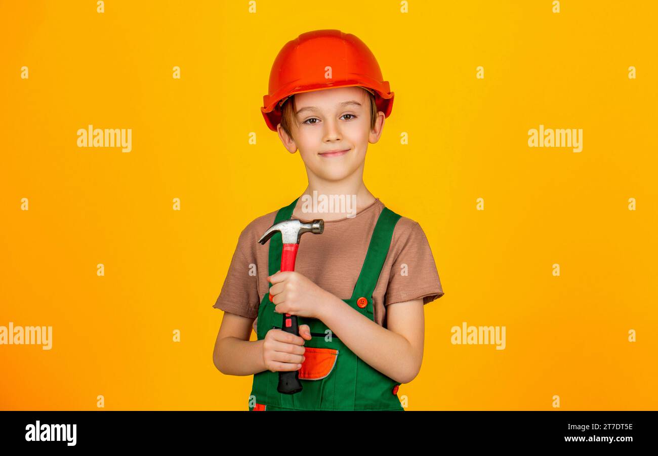 Little builder in hardhats hammer. Child building helmet, hard hat ...