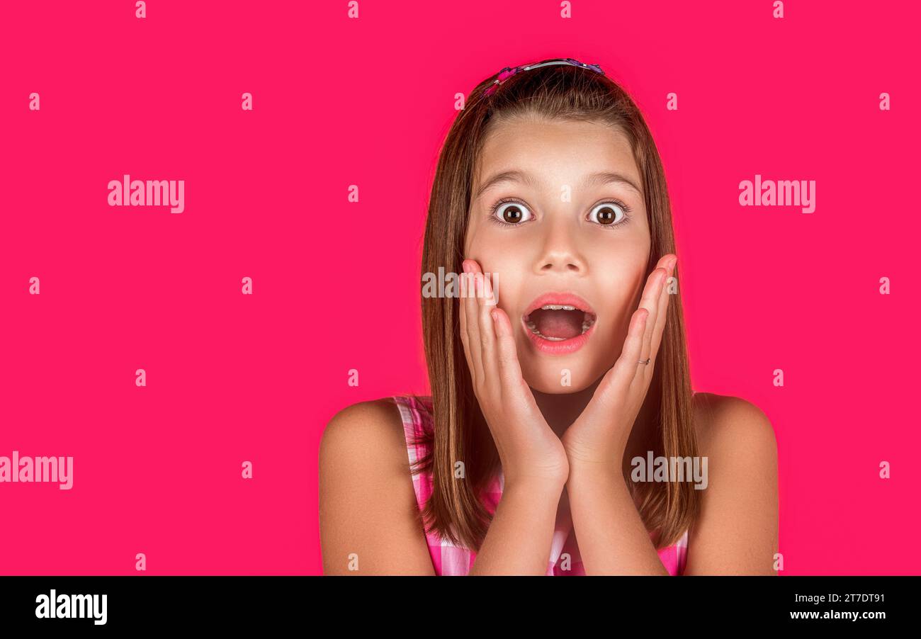 Portrait of surprised little toddler girl child isolated pink ...