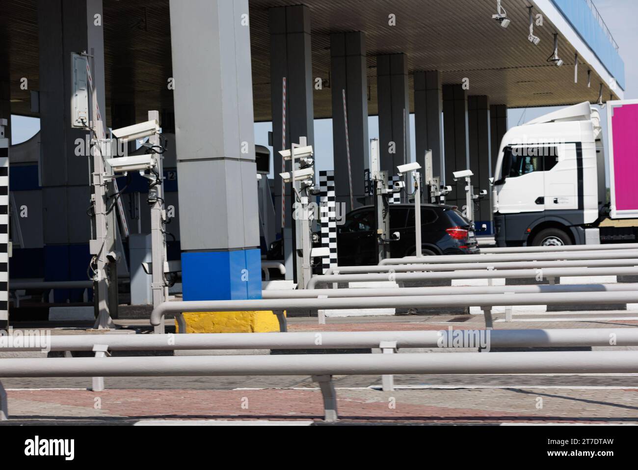 truck and car crossing toll road gates at sunny summer day Stock Photo ...
