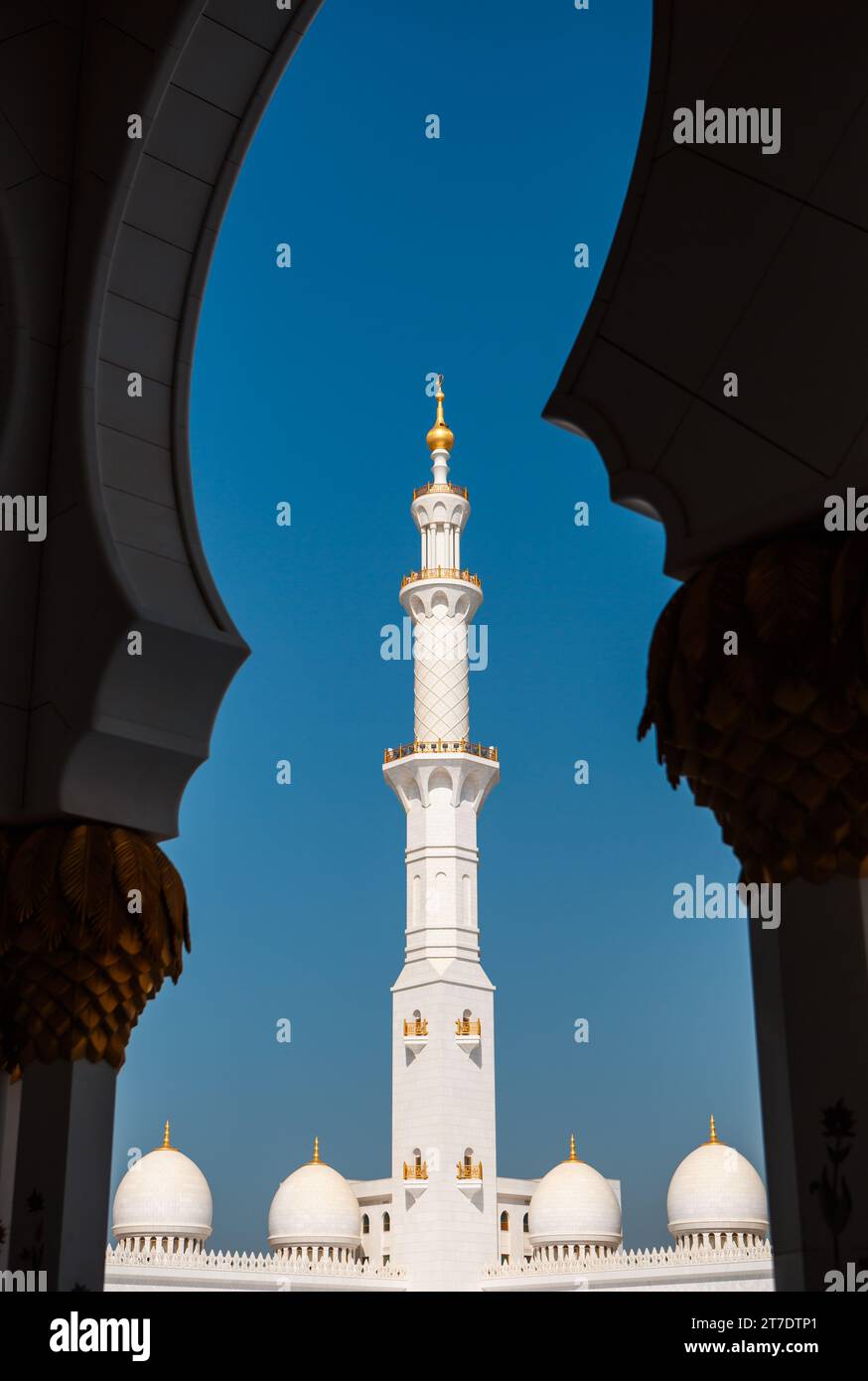 Minaret tower photographed through the arc of Sheikh Zayed Grand Mosque ...