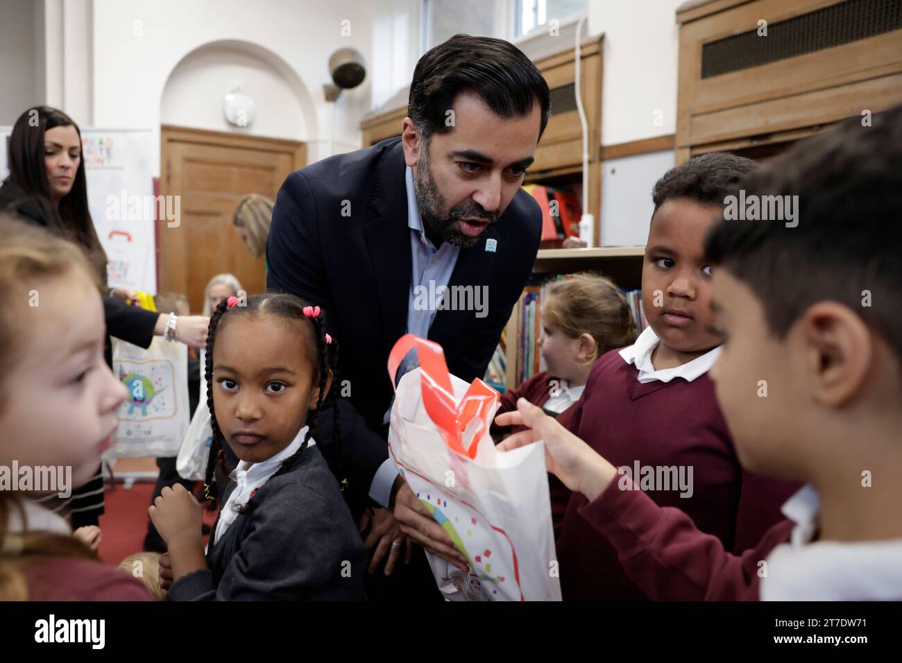 First Minister of Scotland Humza Yousaf hands out book bags to pupils ...