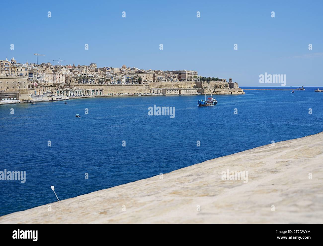 Canal with European VALLETTA capital city of MALTA, clear blue sky in ...