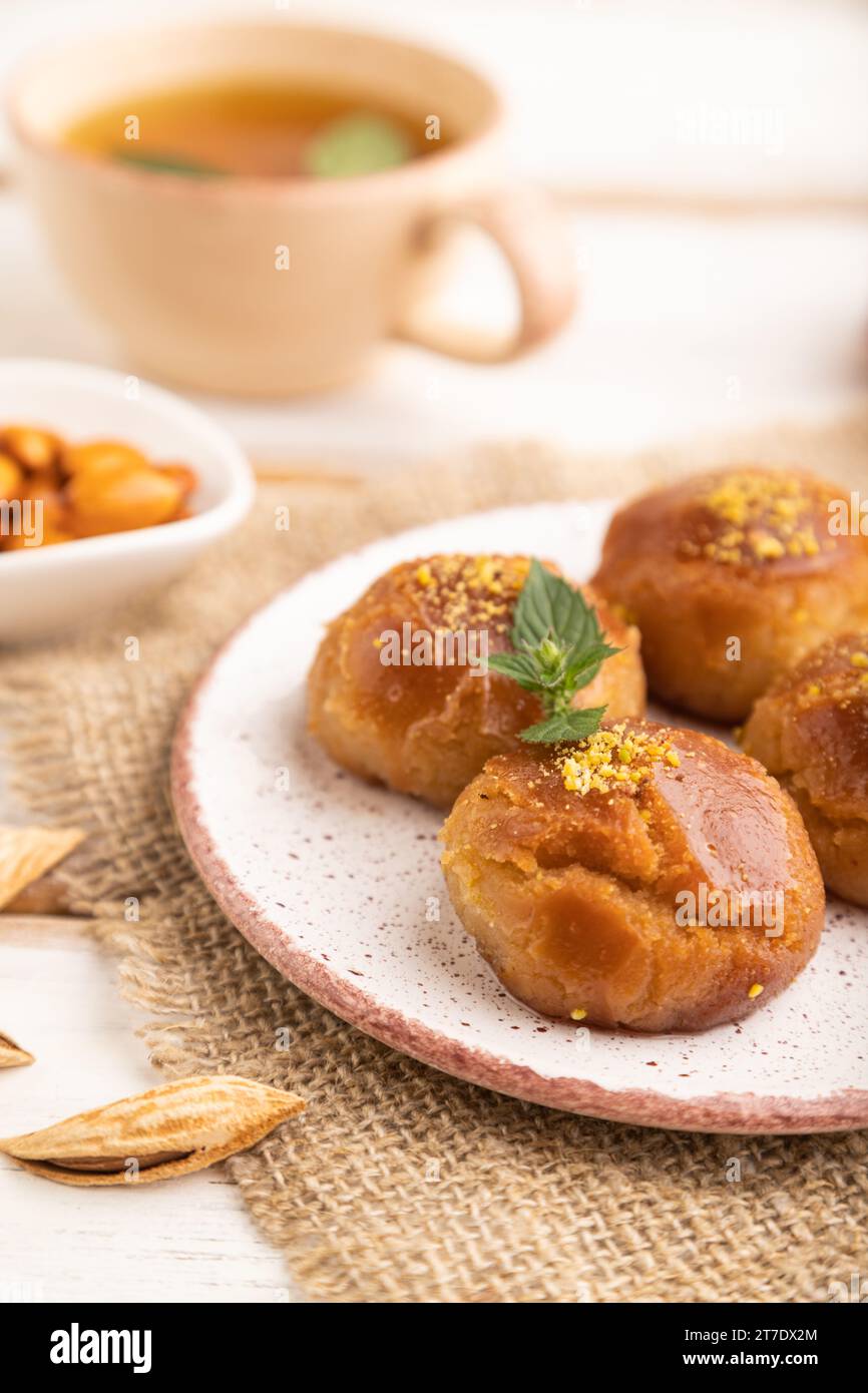 Homemade traditional turkish dessert sekerpare with almonds and honey ...