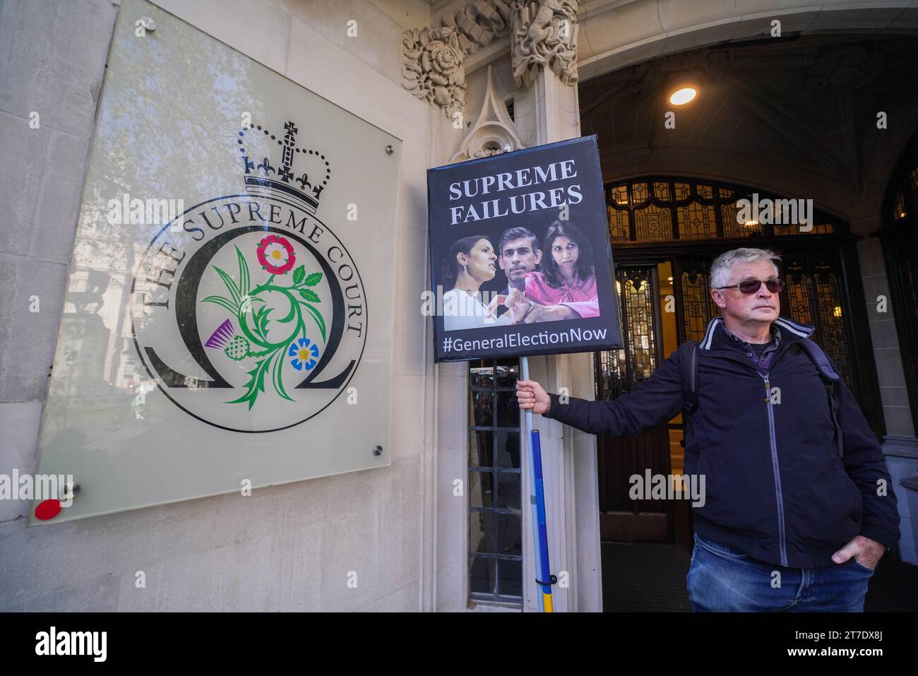 London, UK. 15 November 2023. A protester holds a sign with the ... London, UK. 15 November 2023. A protester holds a sign with the ...