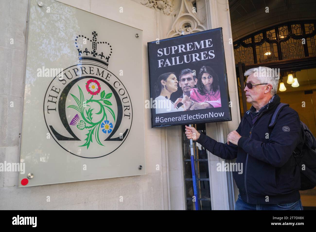 London, UK. 15 November 2023. A protester holds a sign with the ... London, UK. 15 November 2023. A protester holds a sign with the ...
