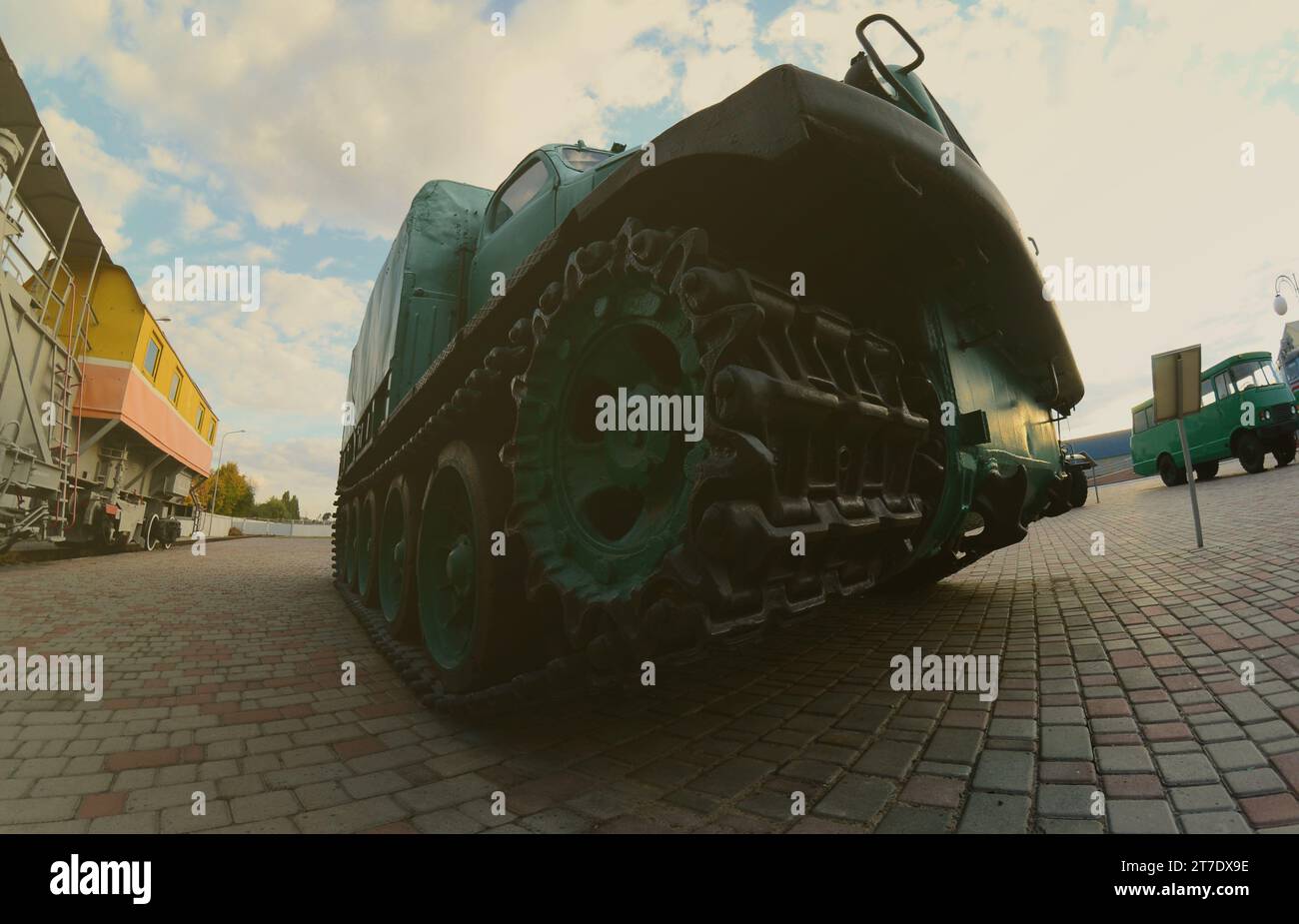 Photo of a Russian green armored car on a caterpillar track among the ...