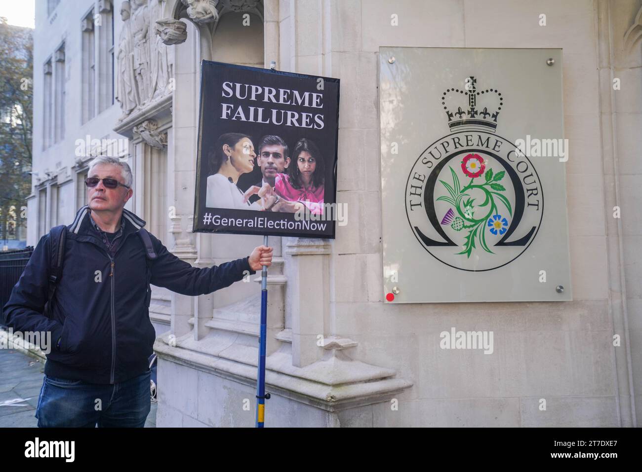 London, UK. 15 November 2023. A protester holds a sign with the ... London, UK. 15 November 2023. A protester holds a sign with the ...