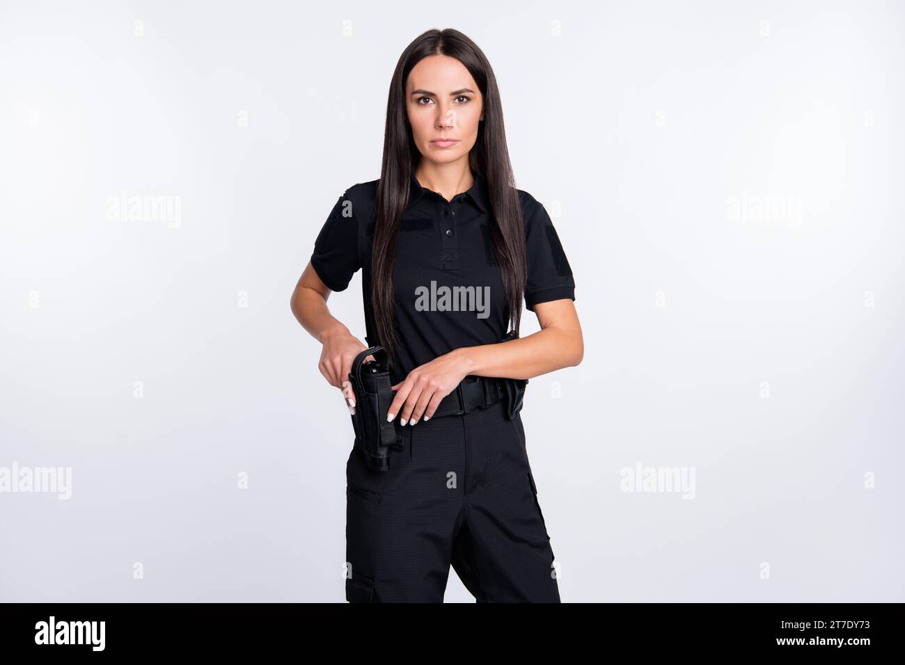 Photo of serious strong young police lady wear black uniform arm weapon ...
