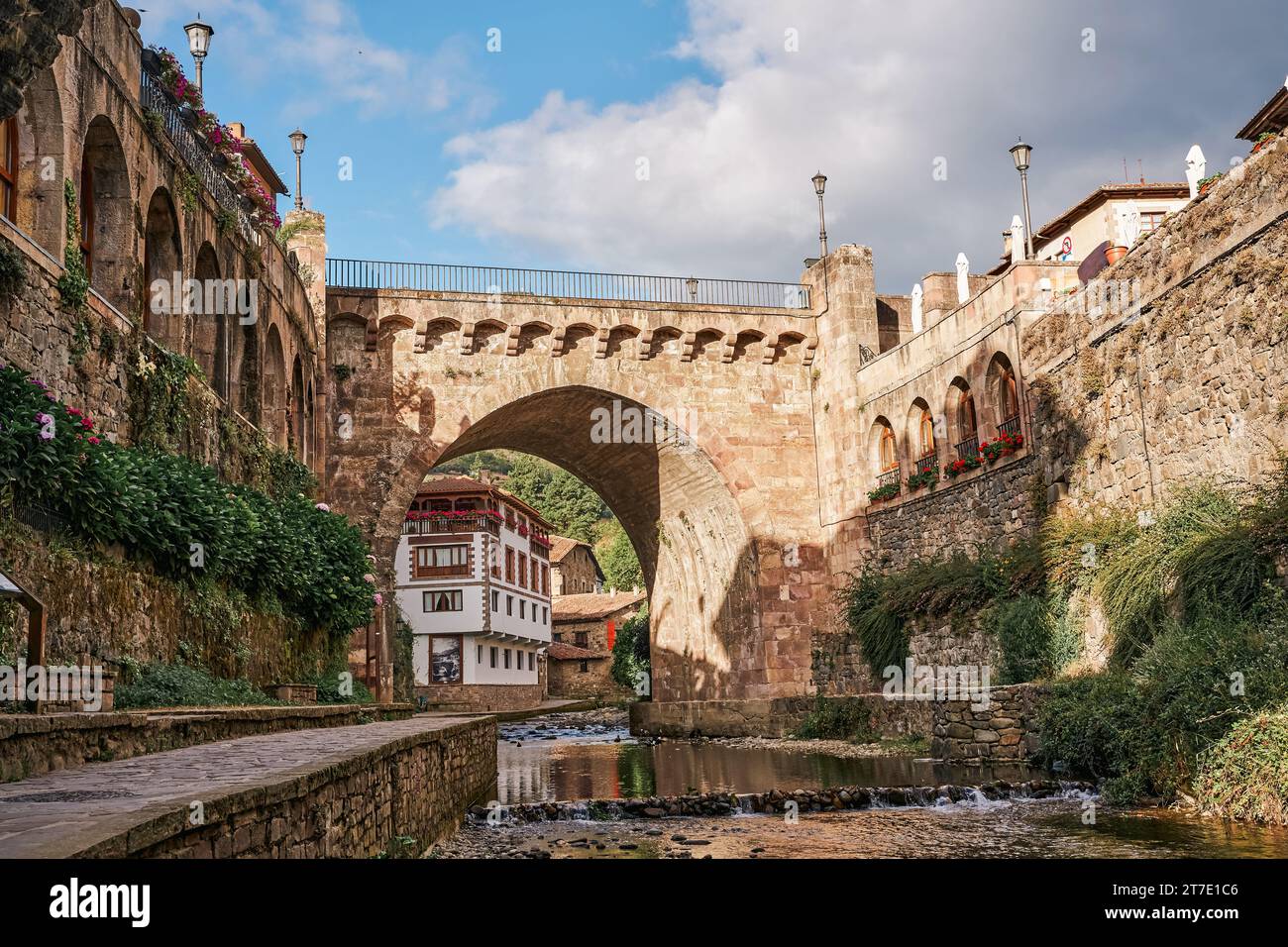 Potes medieval town with bridge and Deva river in its path. In the ...