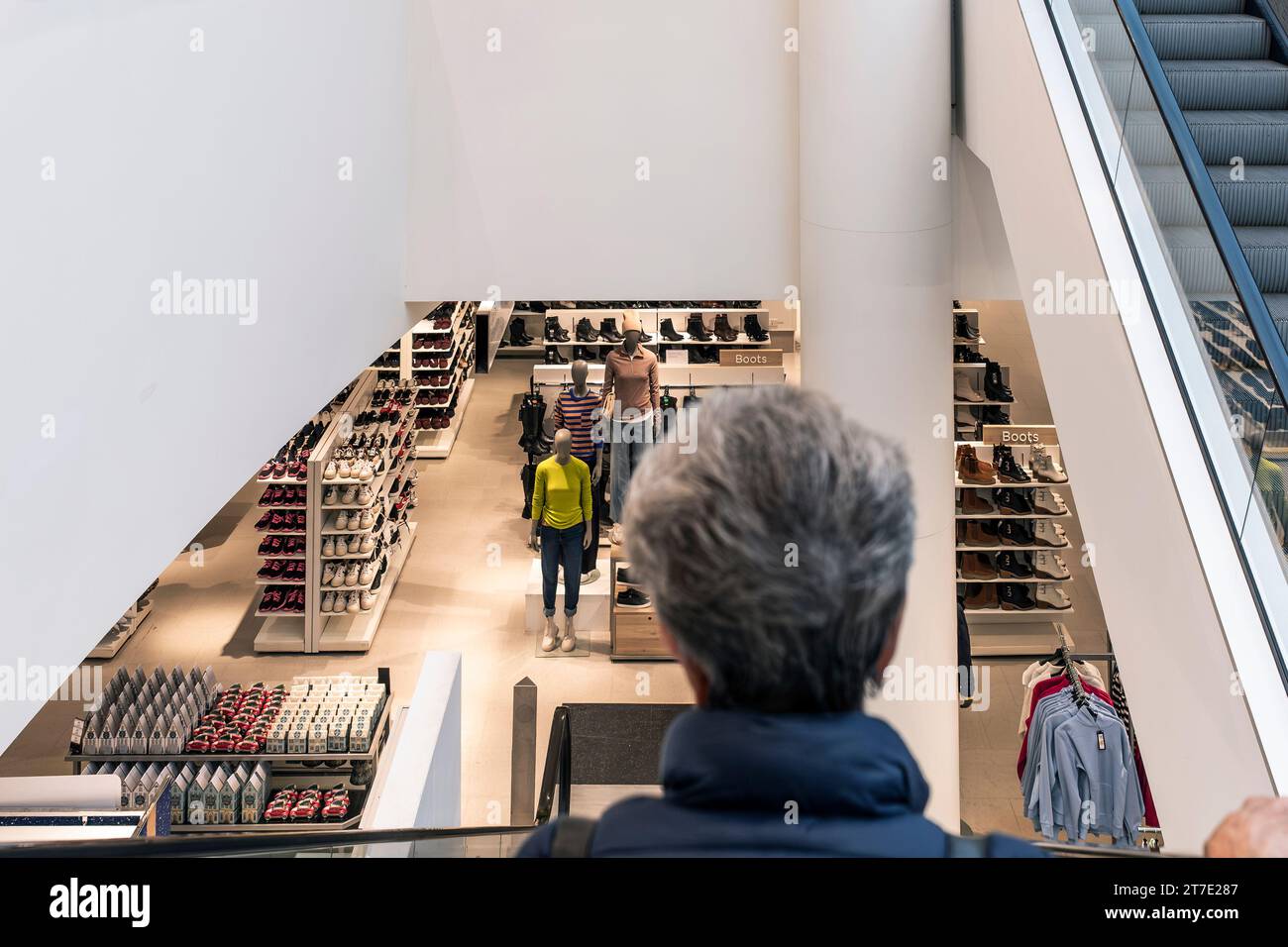 A customer going down on an escalator to the ground floor in Truro in ...