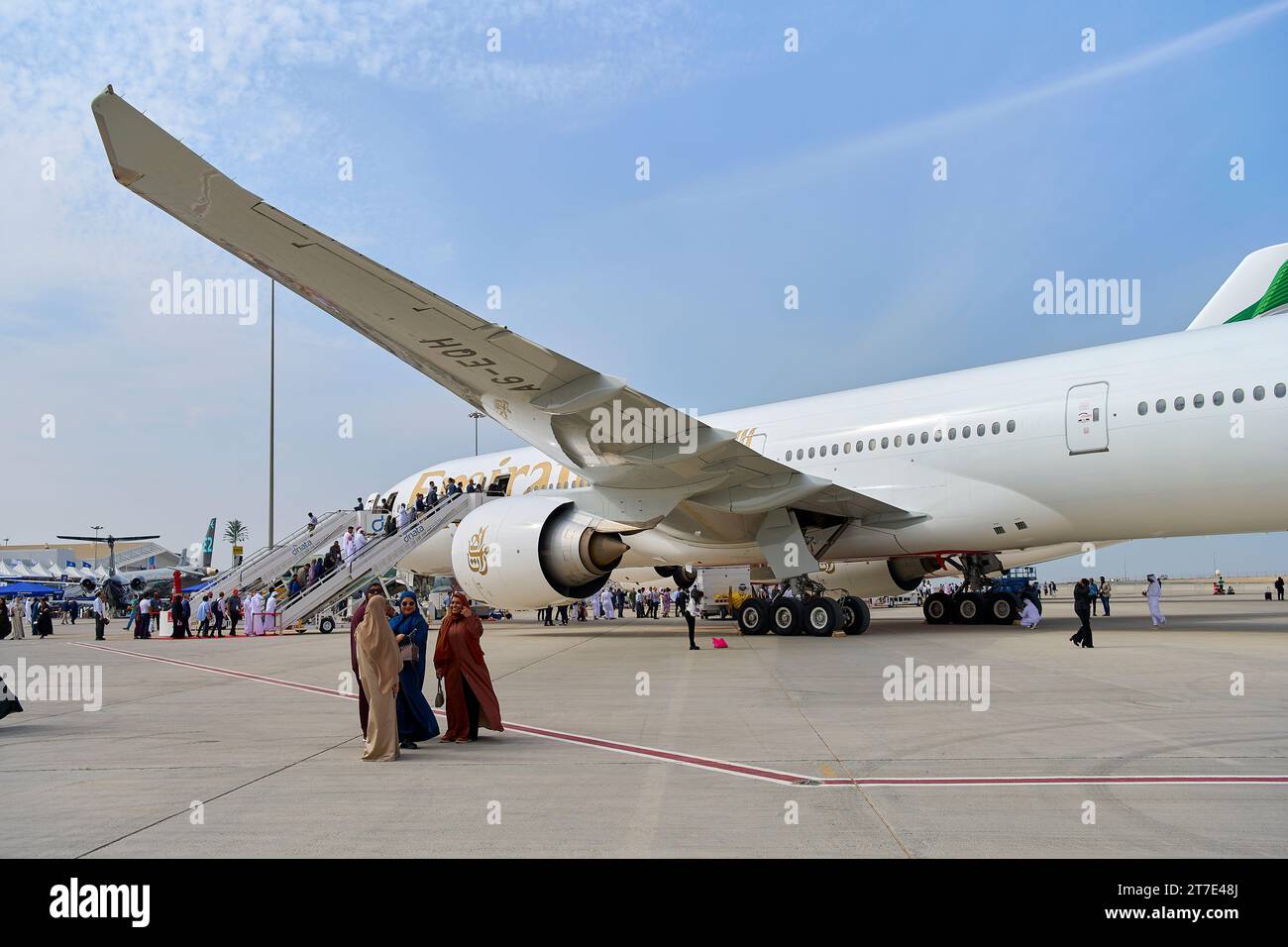DUBAI, UAE, 15th November 2023. Attendees smile besides an Emirates ...