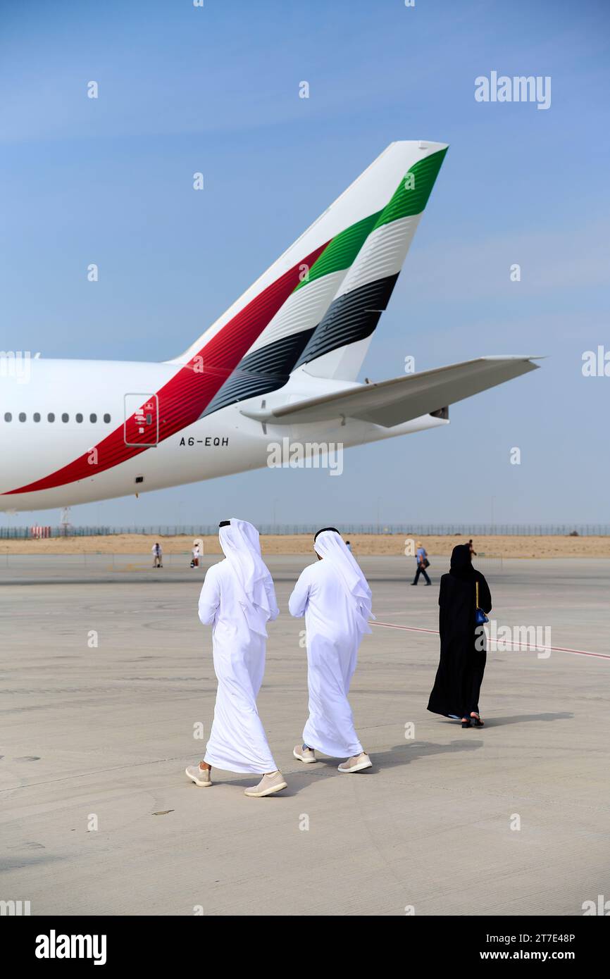 DUBAI, UAE, 15th November 2023. Attendees walk besides an Emirates ...