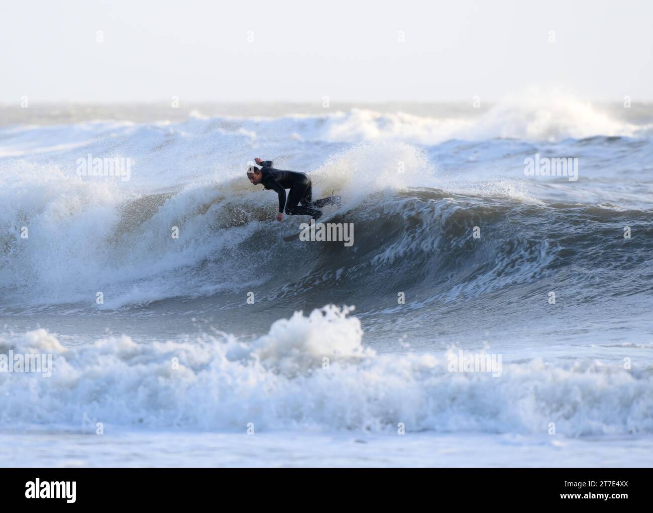 Surfing action on the Gower Stock Photo - Alamy