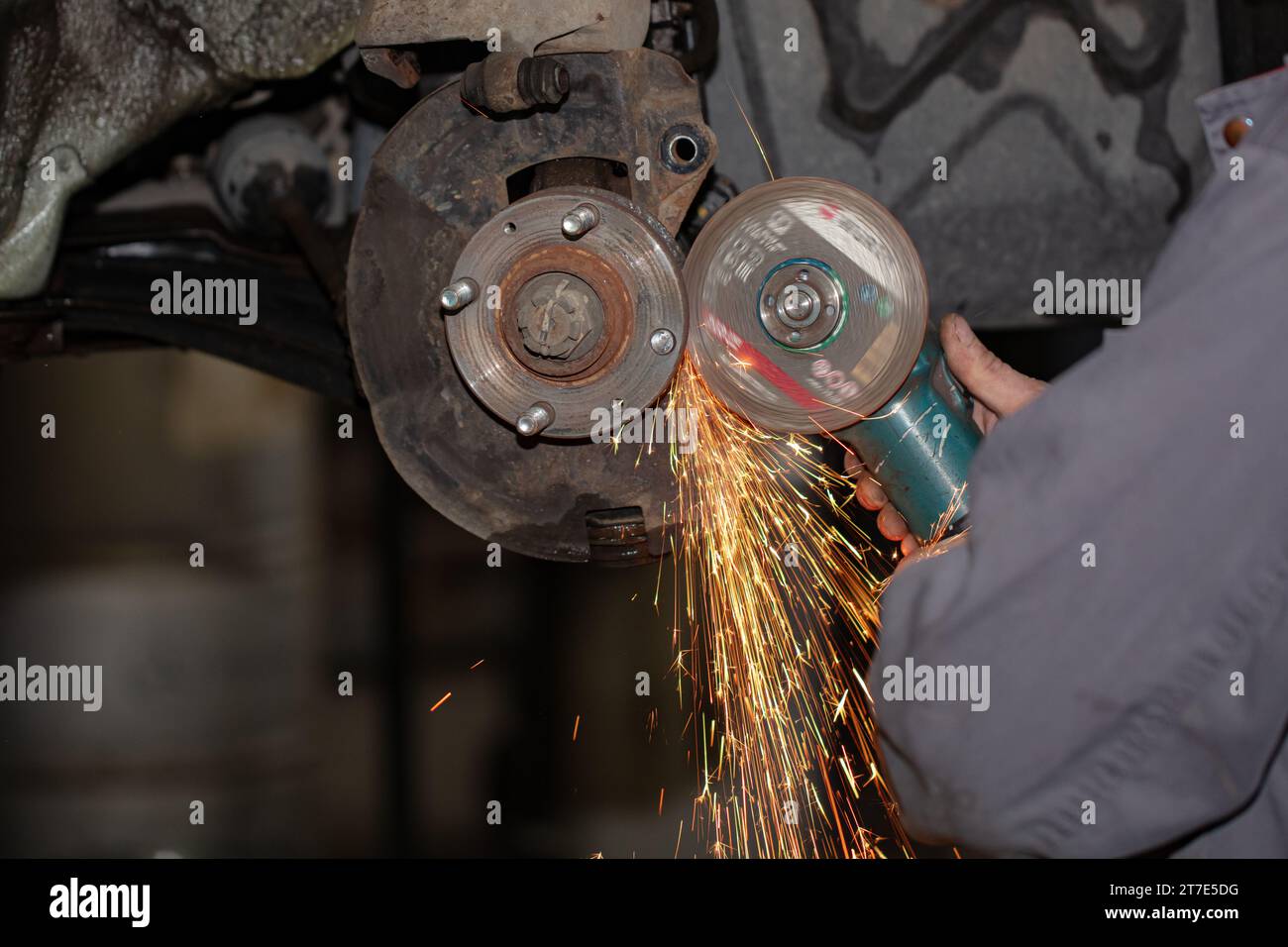 automobile wheel repair using angle grinder in car service Stock Photo ...
