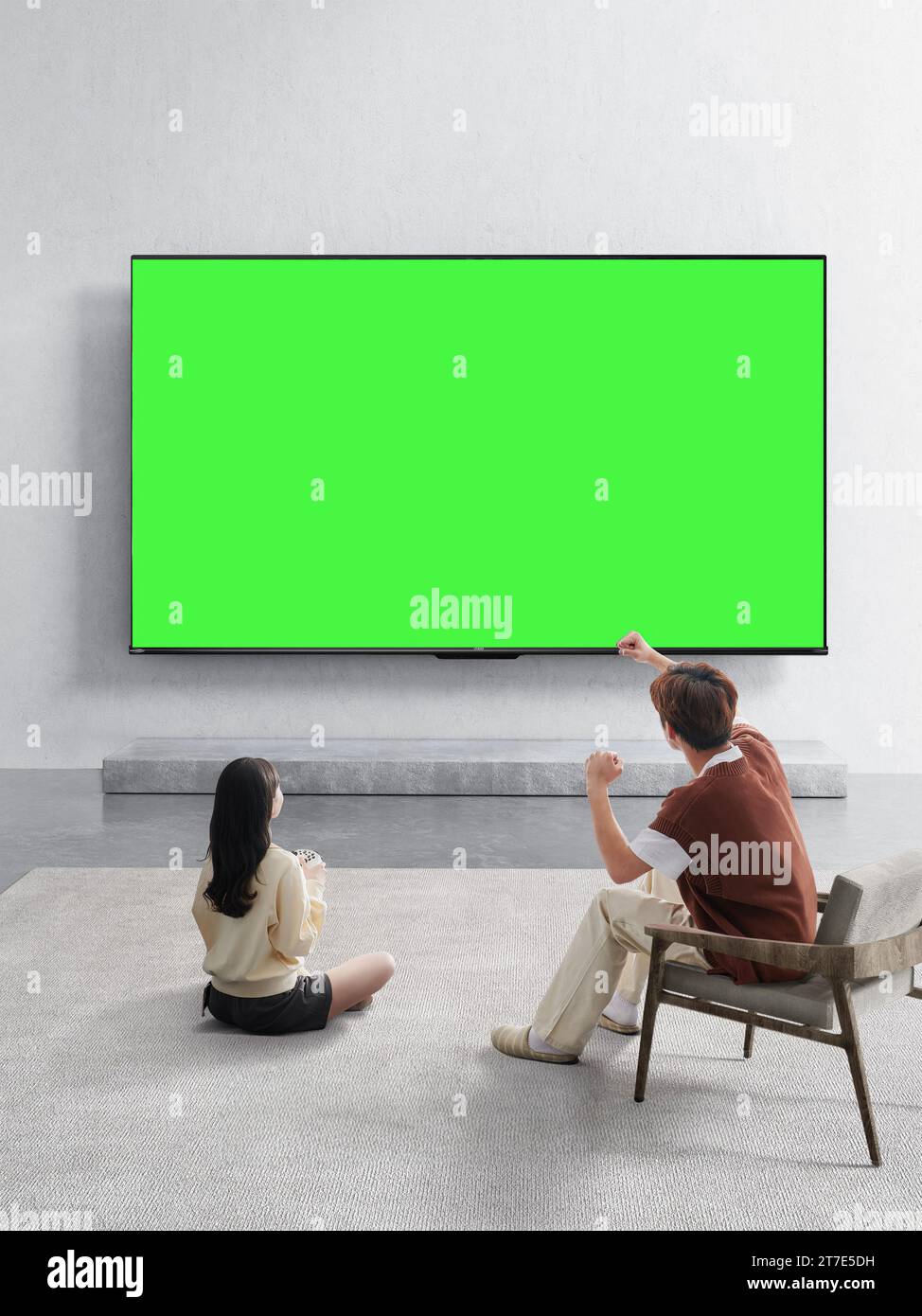 People are watching and enjoying next to the TV, monitor with green ...