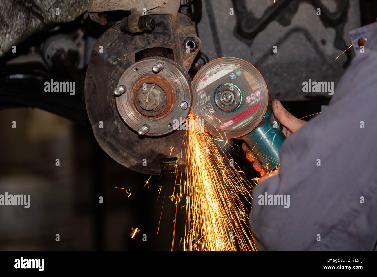 automobile wheel repair using angle grinder in car service Stock Photo ...