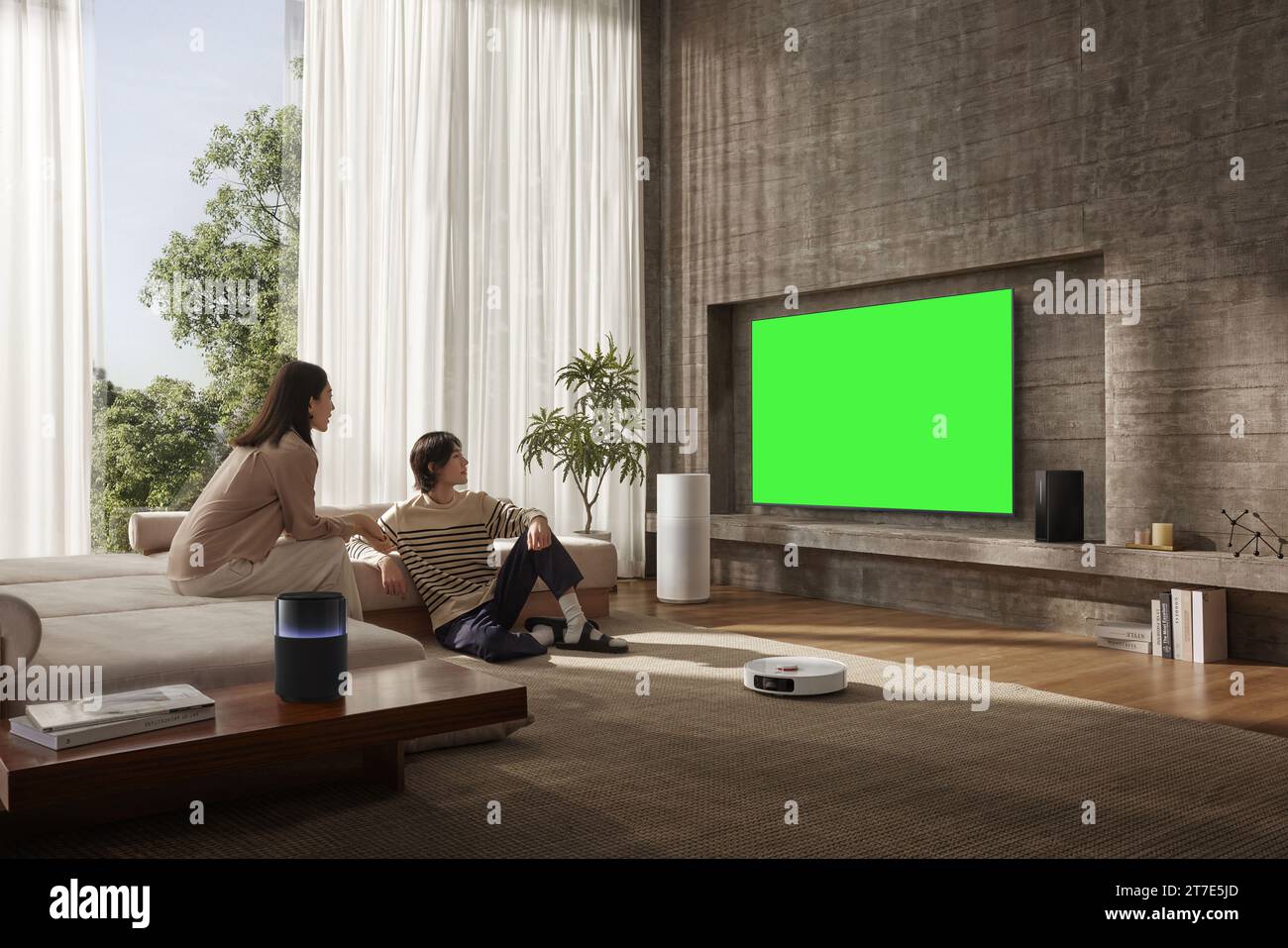 People are watching and enjoying next to the TV, monitor with green ...