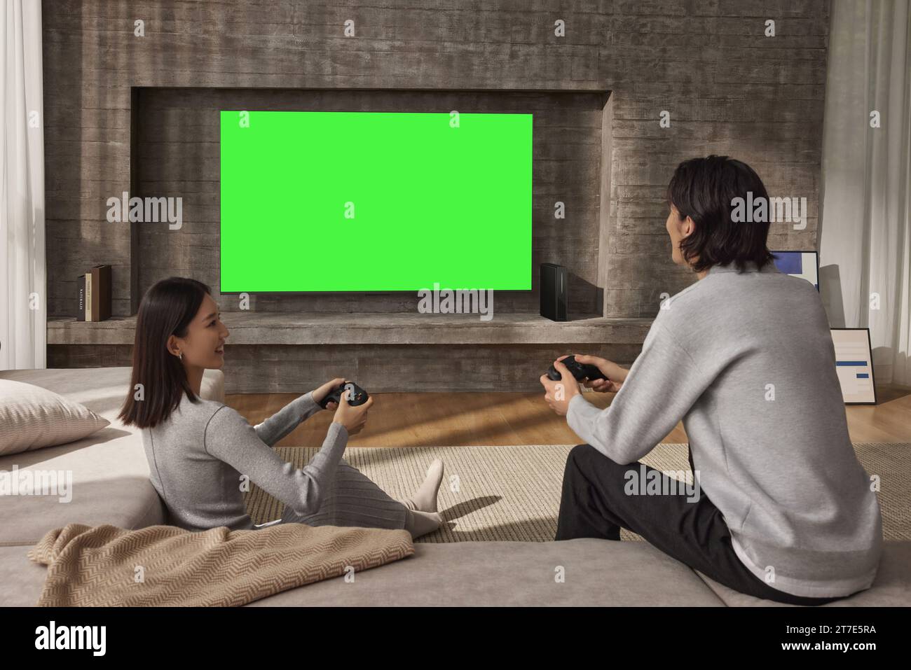 People are watching and enjoying next to the TV, monitor with green ...
