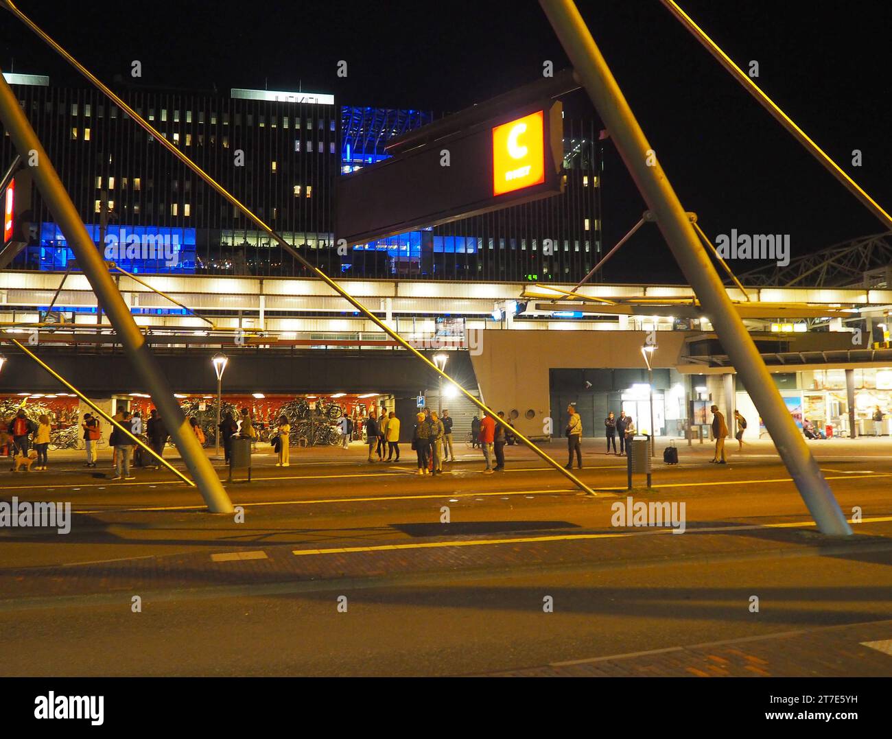 Night atmosphere at large and modern bus stop with steel architecture ...