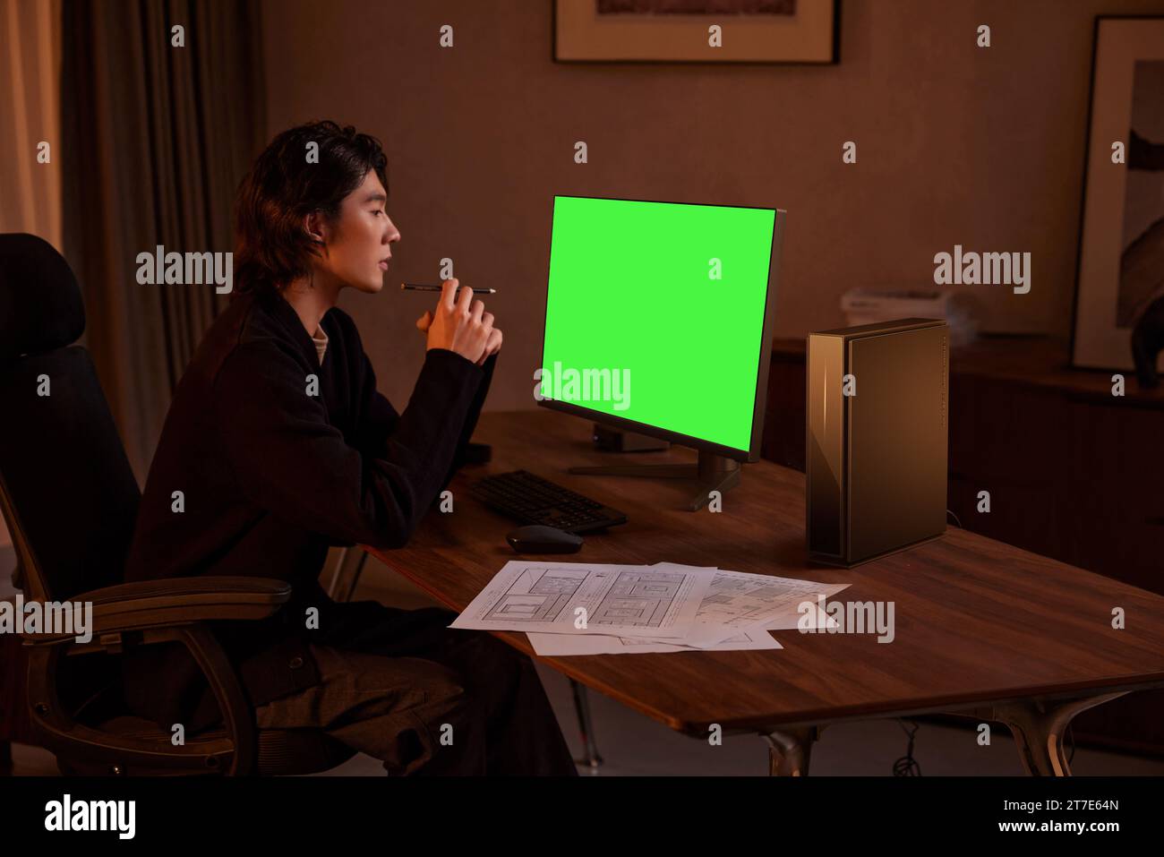 People are watching and enjoying next to the TV, monitor with green ...