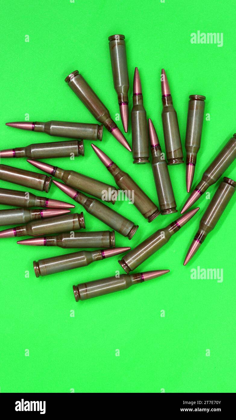 Scattered Bullets On A Green Surface Isolated Vertical Background Stock ...