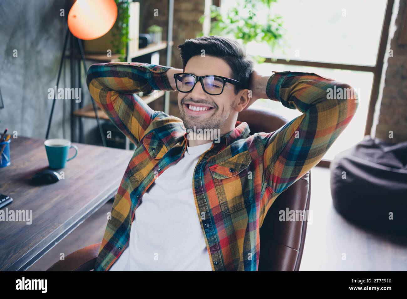 Portrait of positive project manager guy sitting chair closed eyes ...