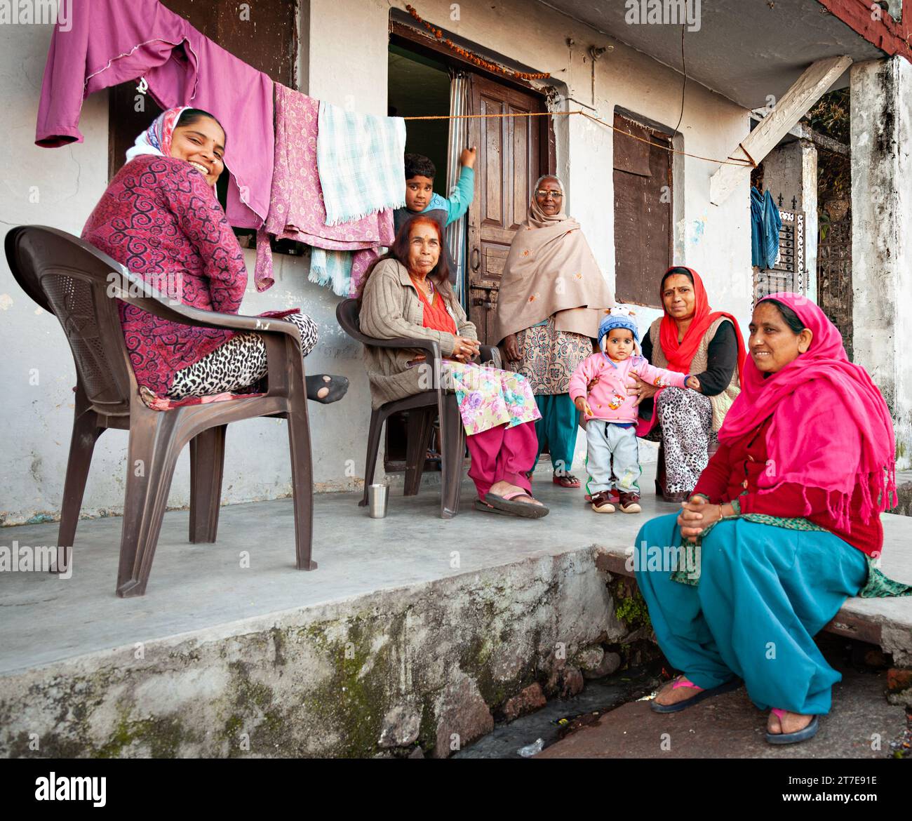 Group of Indian women in Rajpur, chatting in the street with child ...