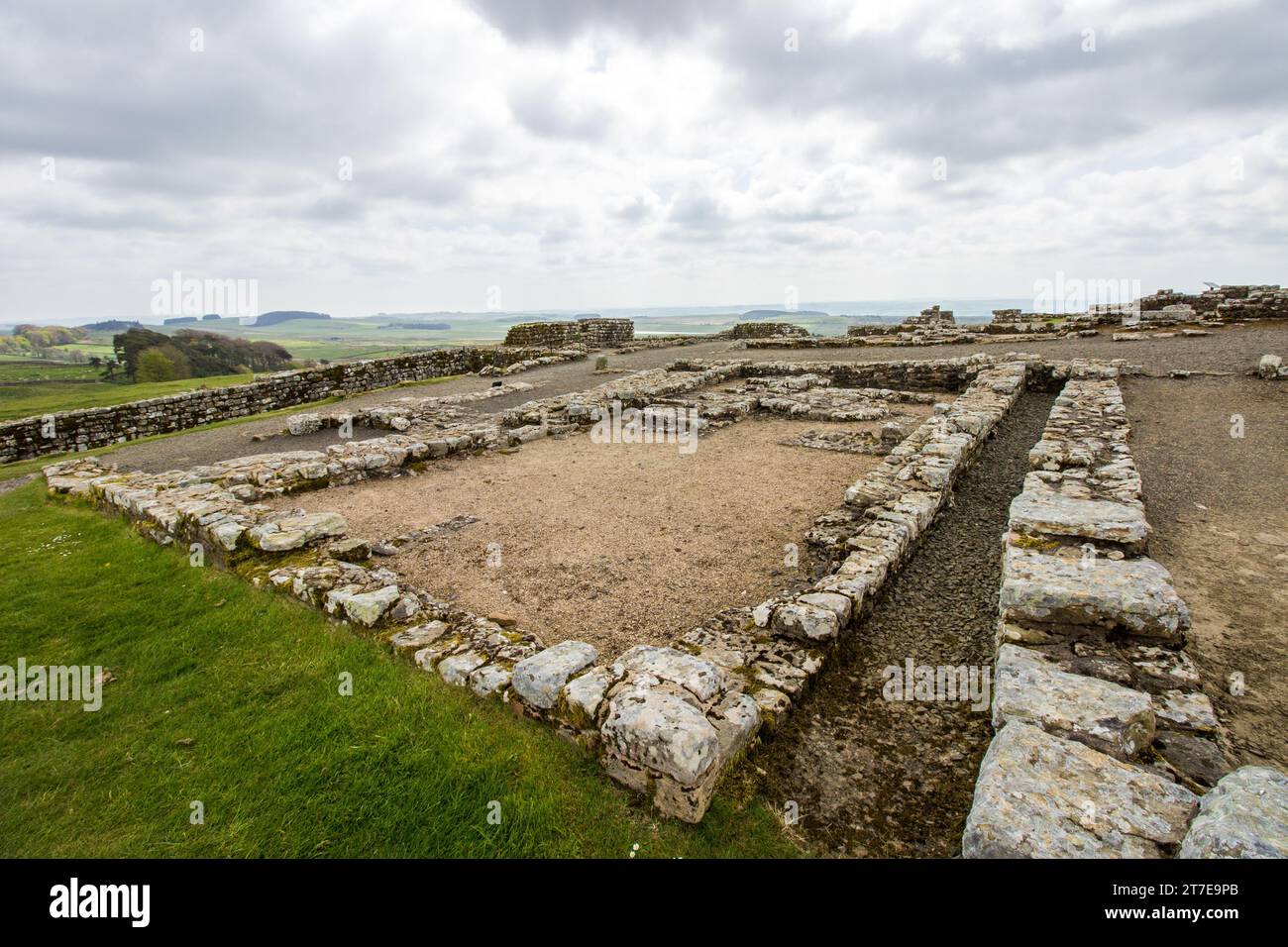 Looking out over the ruins of the barracks at Housestead fort, a Roman ...