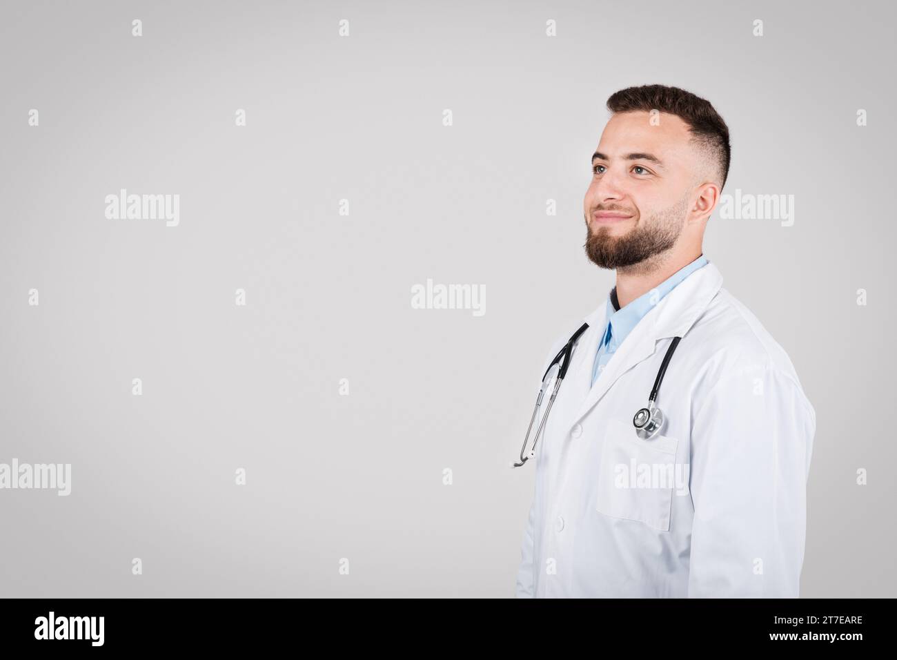 Confident male doctor smiling, stethoscope on neck Stock Photo - Alamy