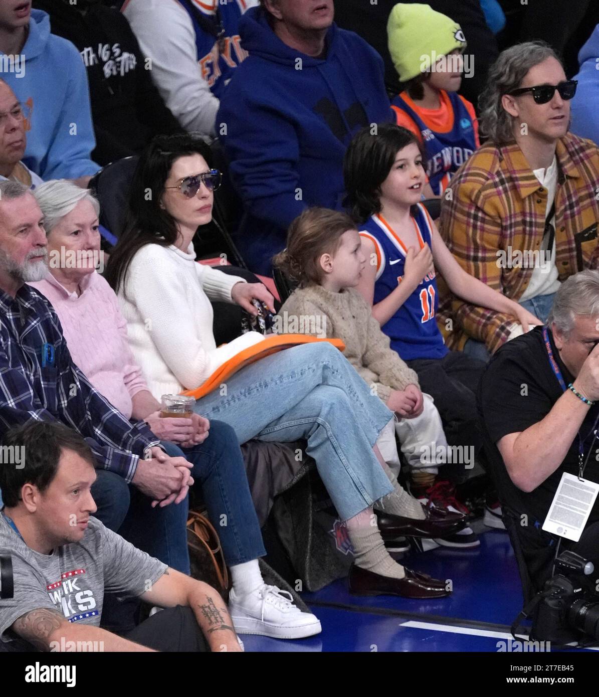 Anne Hathaway and her Husband Adam at the NY Knicks game with her two sons, Jonathan and Jack ...