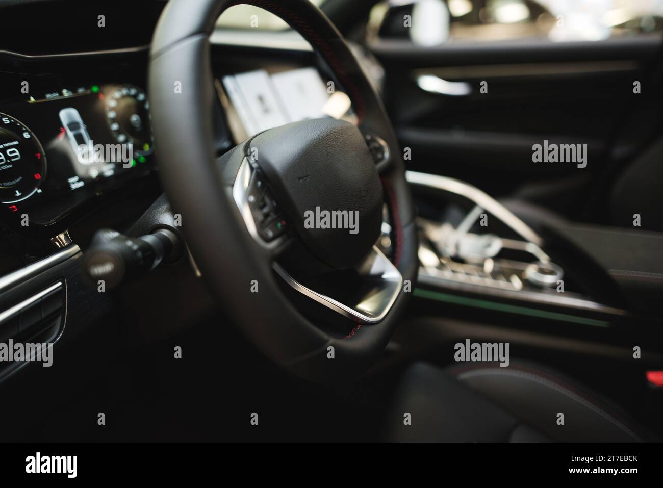 interior of an expensive car, steering wheel, panels. High quality ...