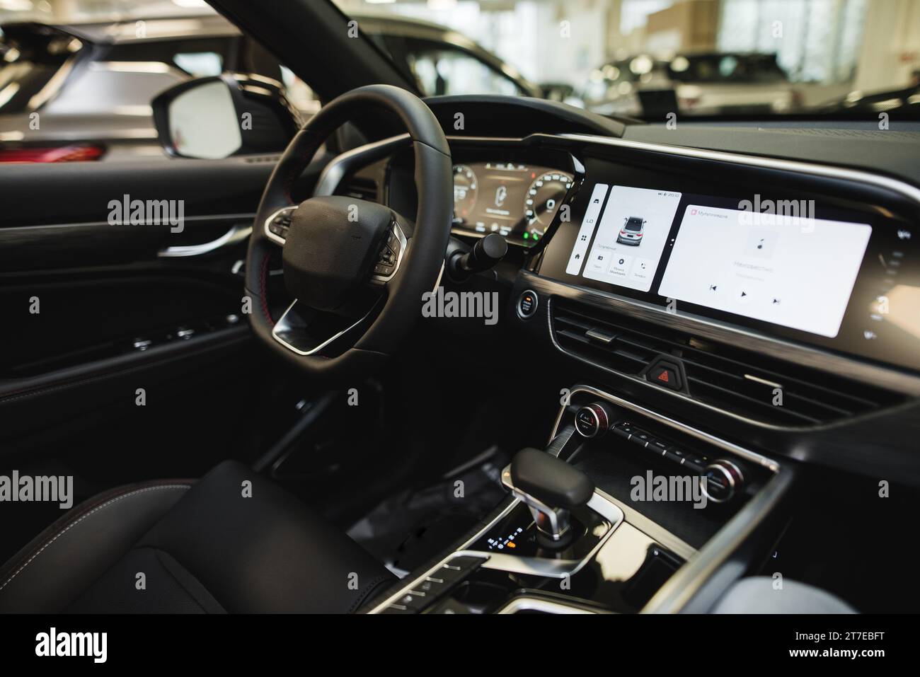 interior of an expensive car, steering wheel, panels. High quality ...