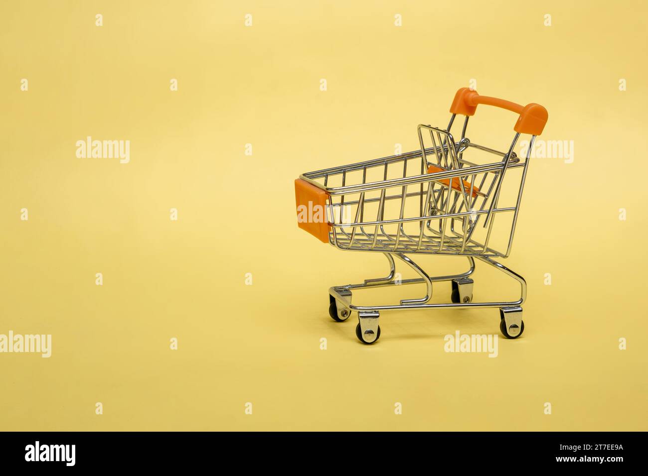 Small supermarket grocery push cart for shopping. Shopaholic Stock ...