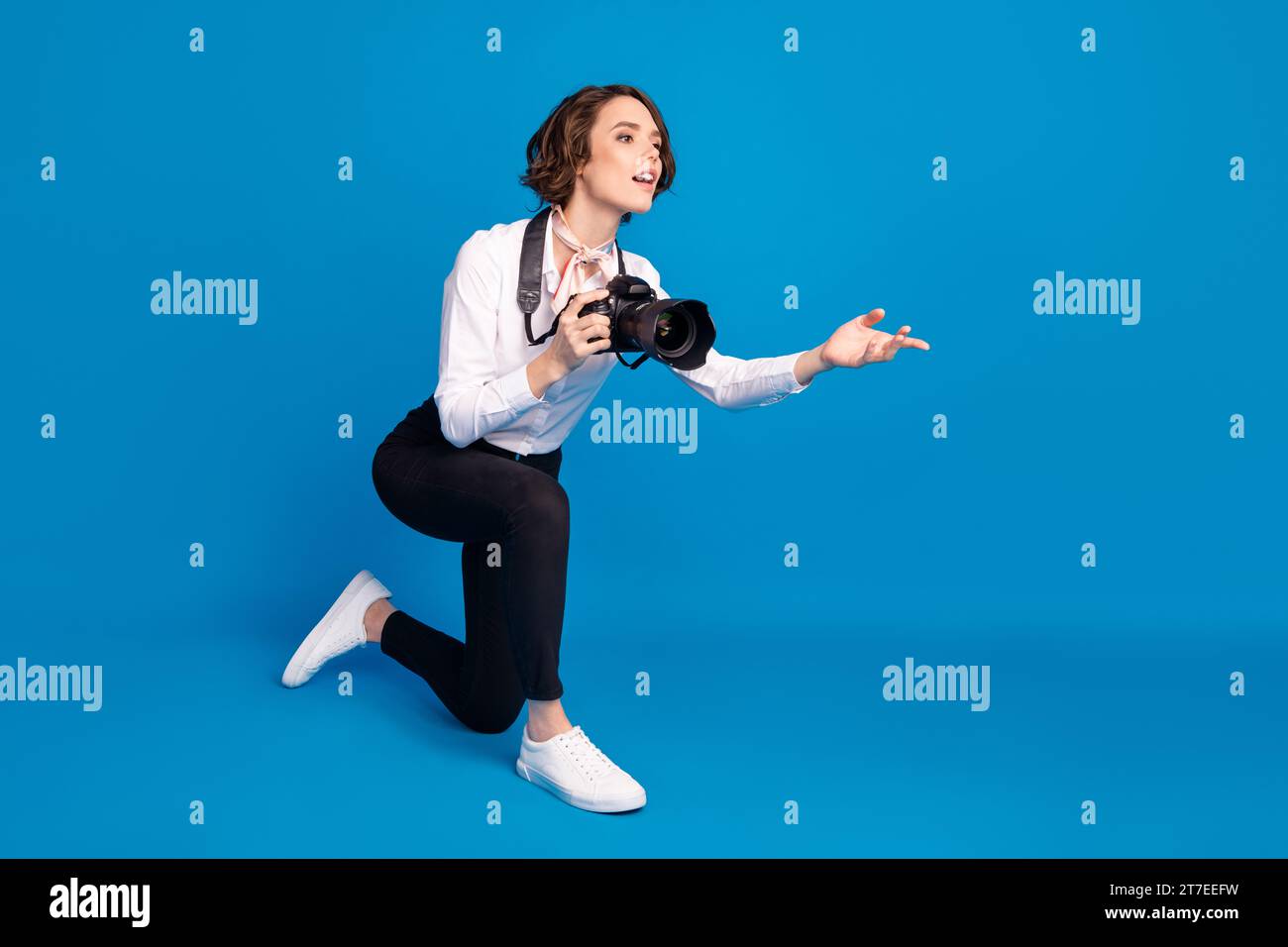 Full length profile portrait of pretty lady stand on knee look direct ...