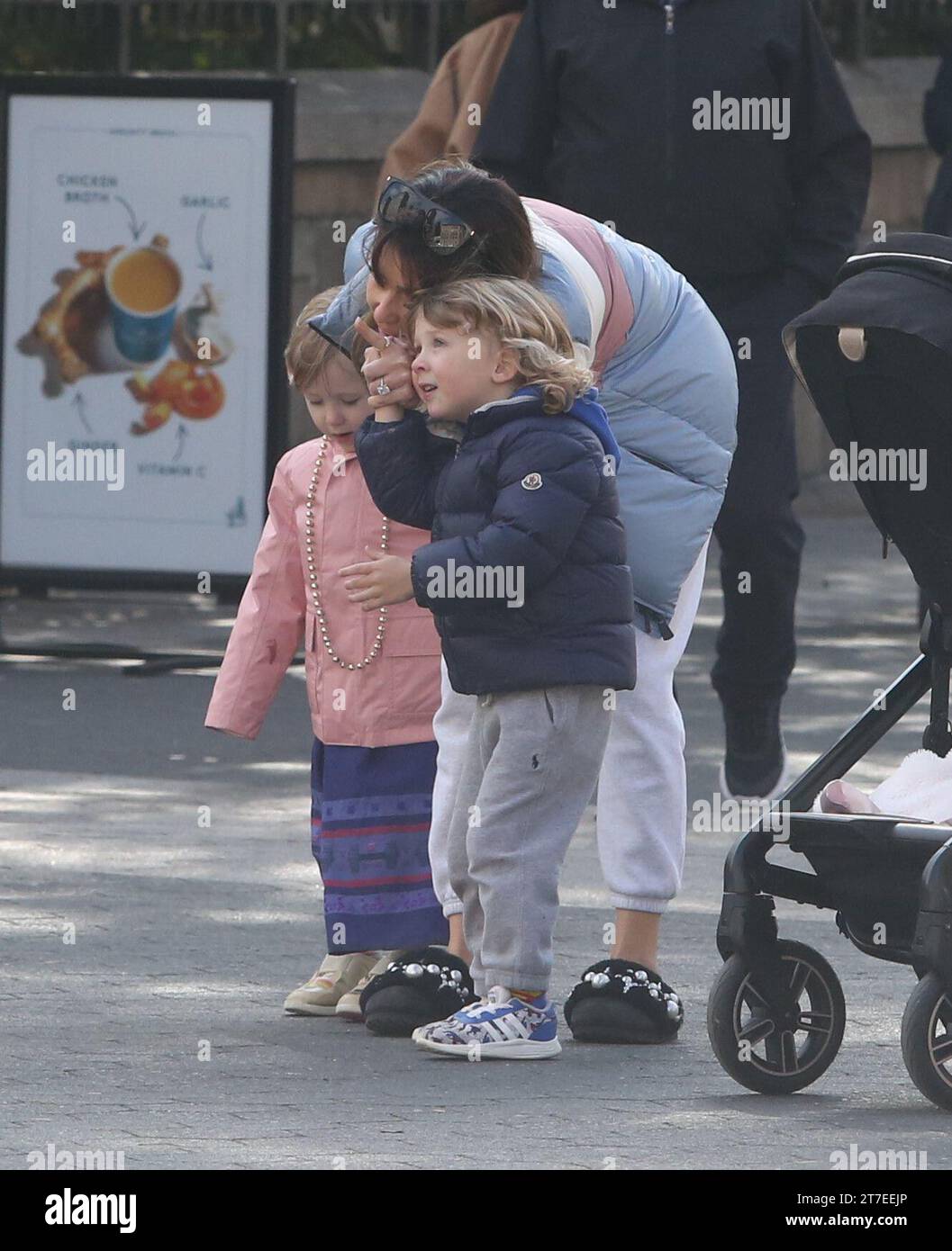 Hilaria Baldwin (wearing an "Empathy always' sweatshirt) out with 4 of ...