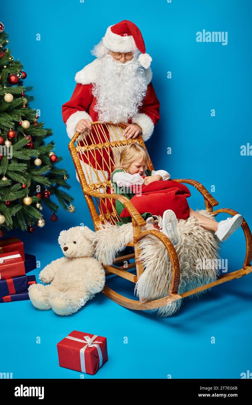 Santa Claus rocking chair with cute girl with prosthetic leg holding ...