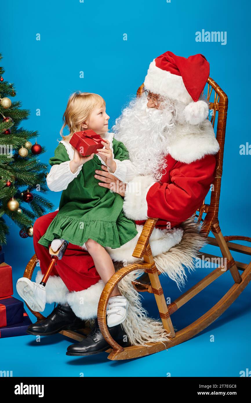 Girl sitting on santa claus hi-res stock photography and images - Alamy