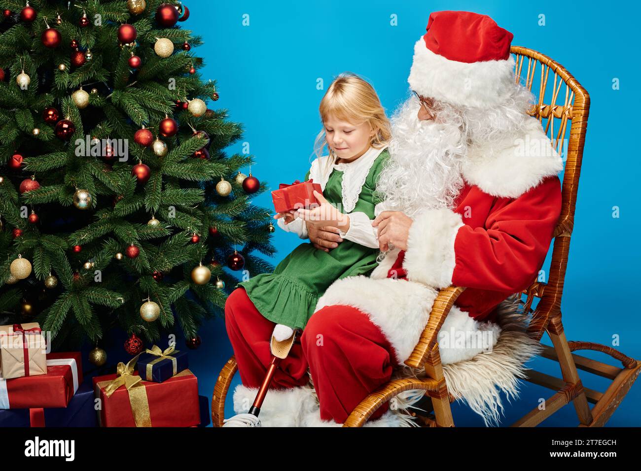 happy girl with prosthetic leg sitting on laps of Santa Claus with ...