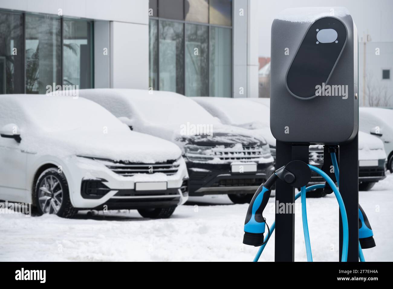 Electric car charging station on a background of snow covered winter ...