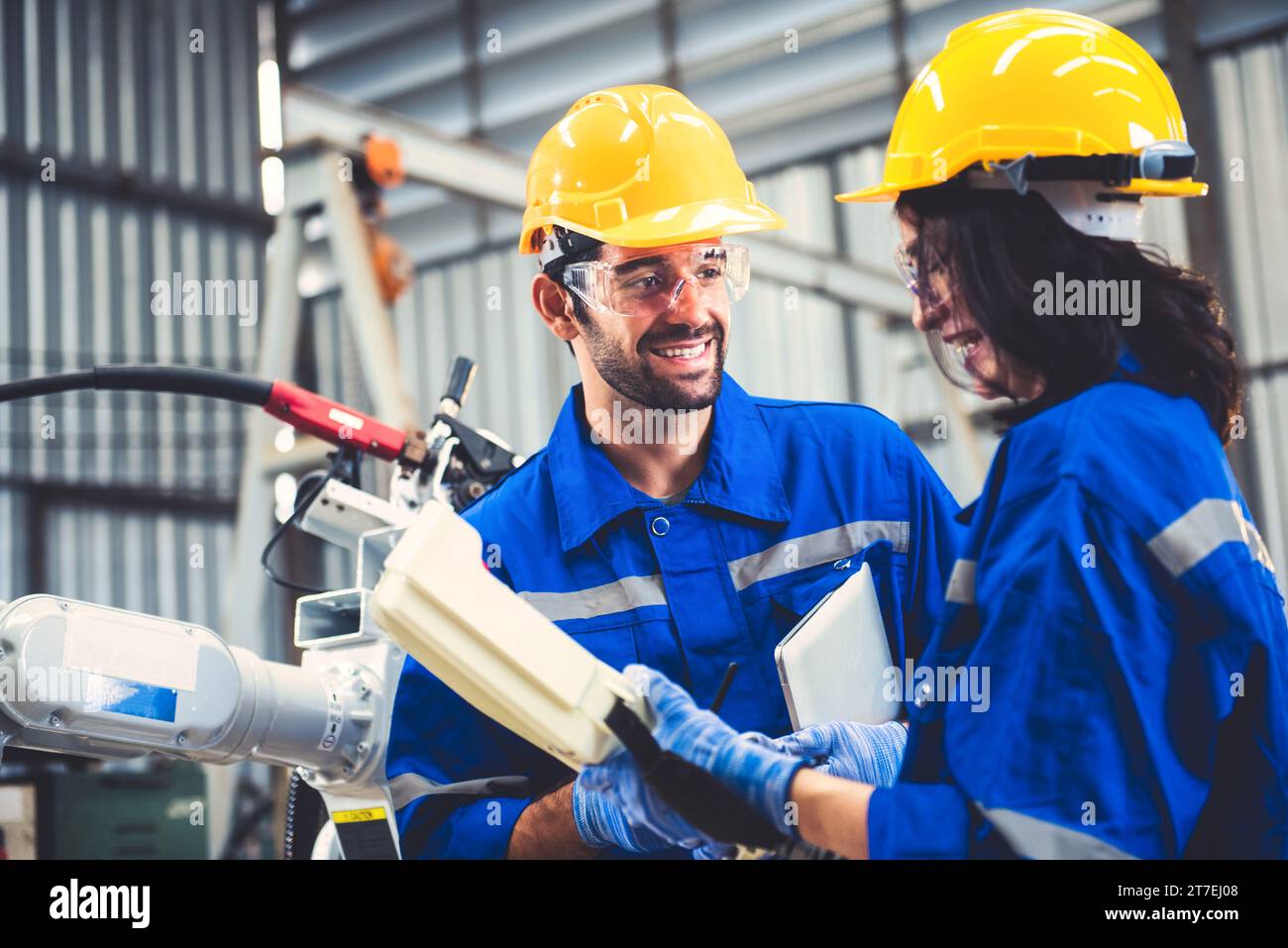 Engineers team mechanic using computer controller Robotic arm for ...