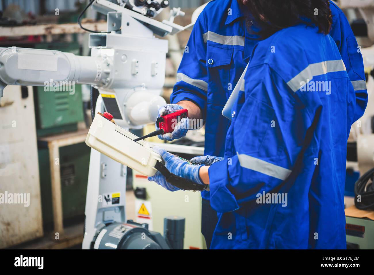 Engineers team mechanic using computer controller Robotic arm for ...