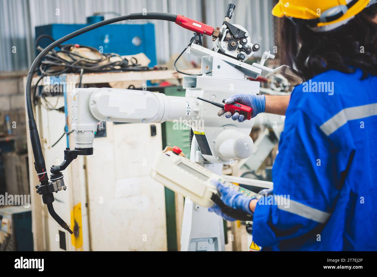 Engineers team mechanic using computer controller Robotic arm for ...
