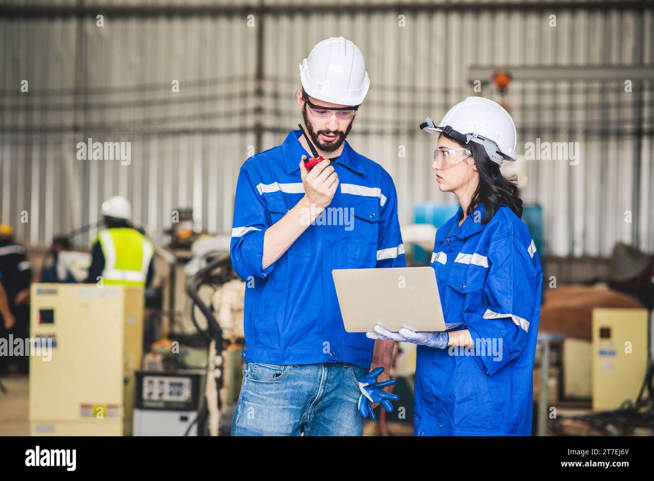 Engineers team mechanic using computer controller Robotic arm for ...