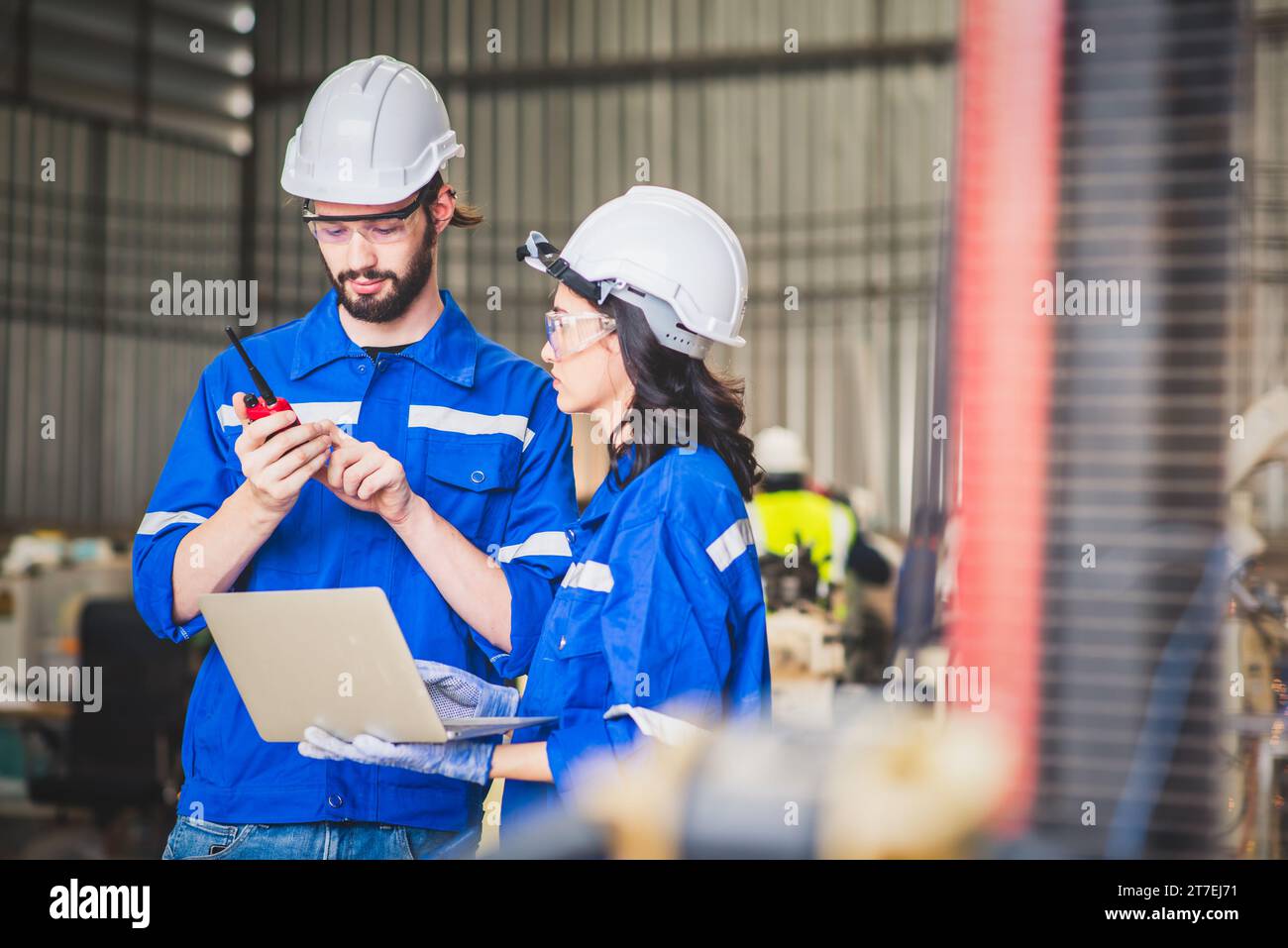 Engineers team mechanic using computer controller Robotic arm for ...